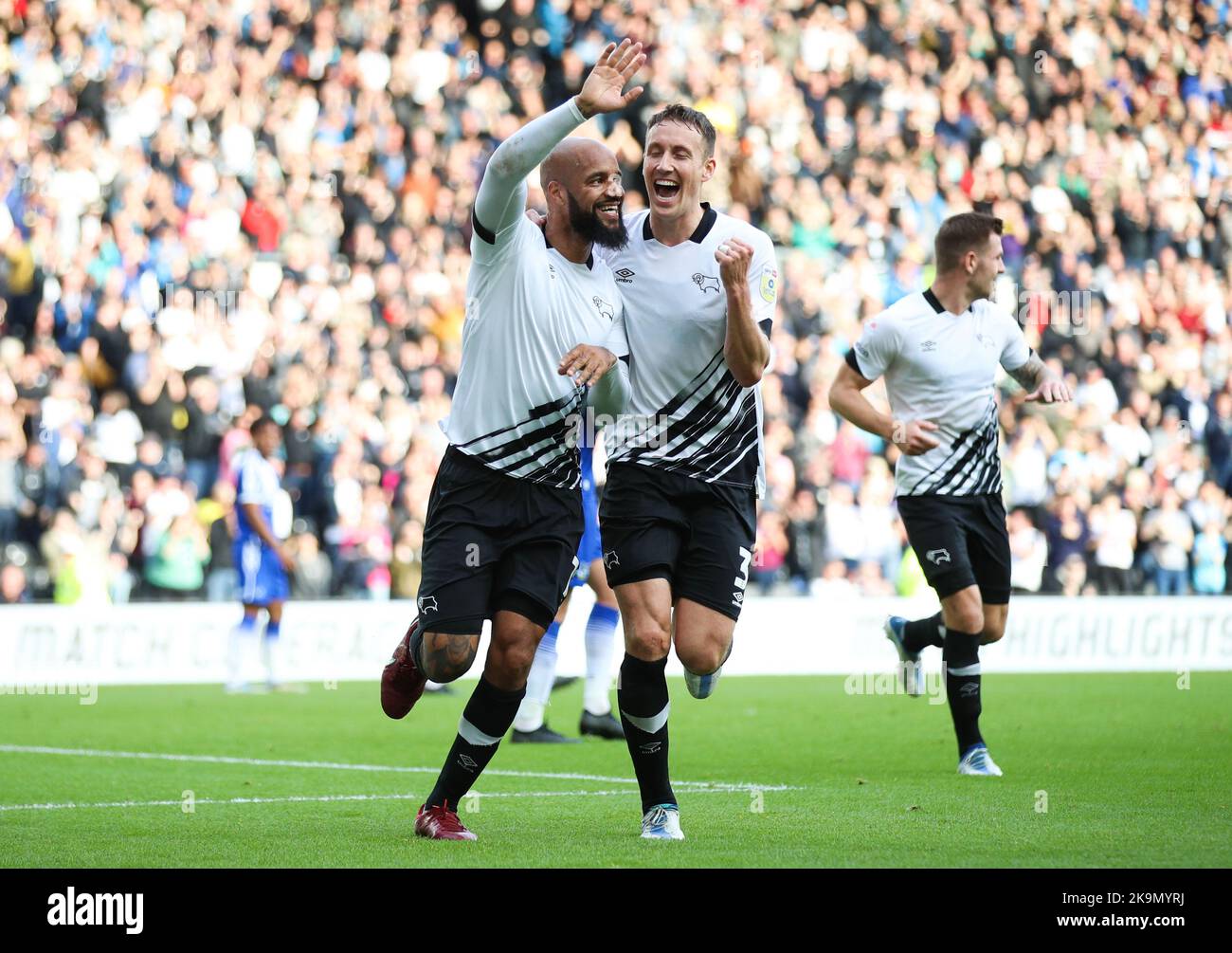Derby County's David McGoldrick (left) celebrates with Craig Forsyth ...
