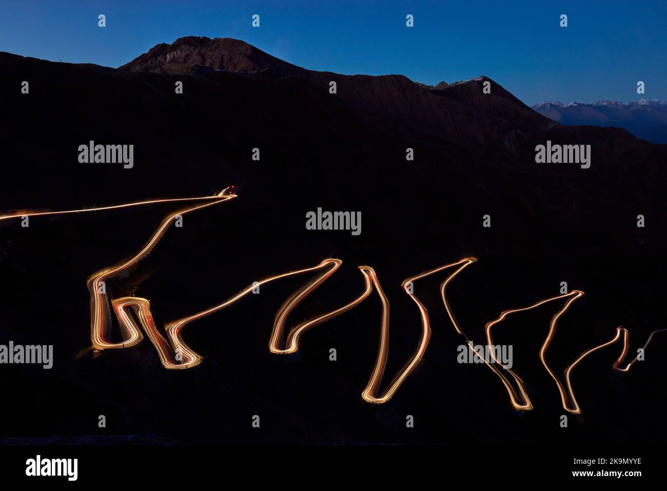 Car lights form light traces along the Stilfser Joch at night Stock ...