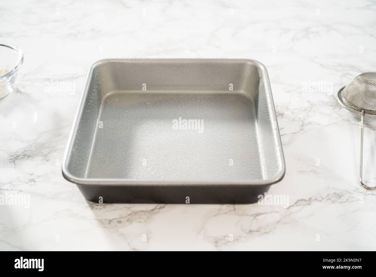 Greasing baking pan Stock Photo - Alamy