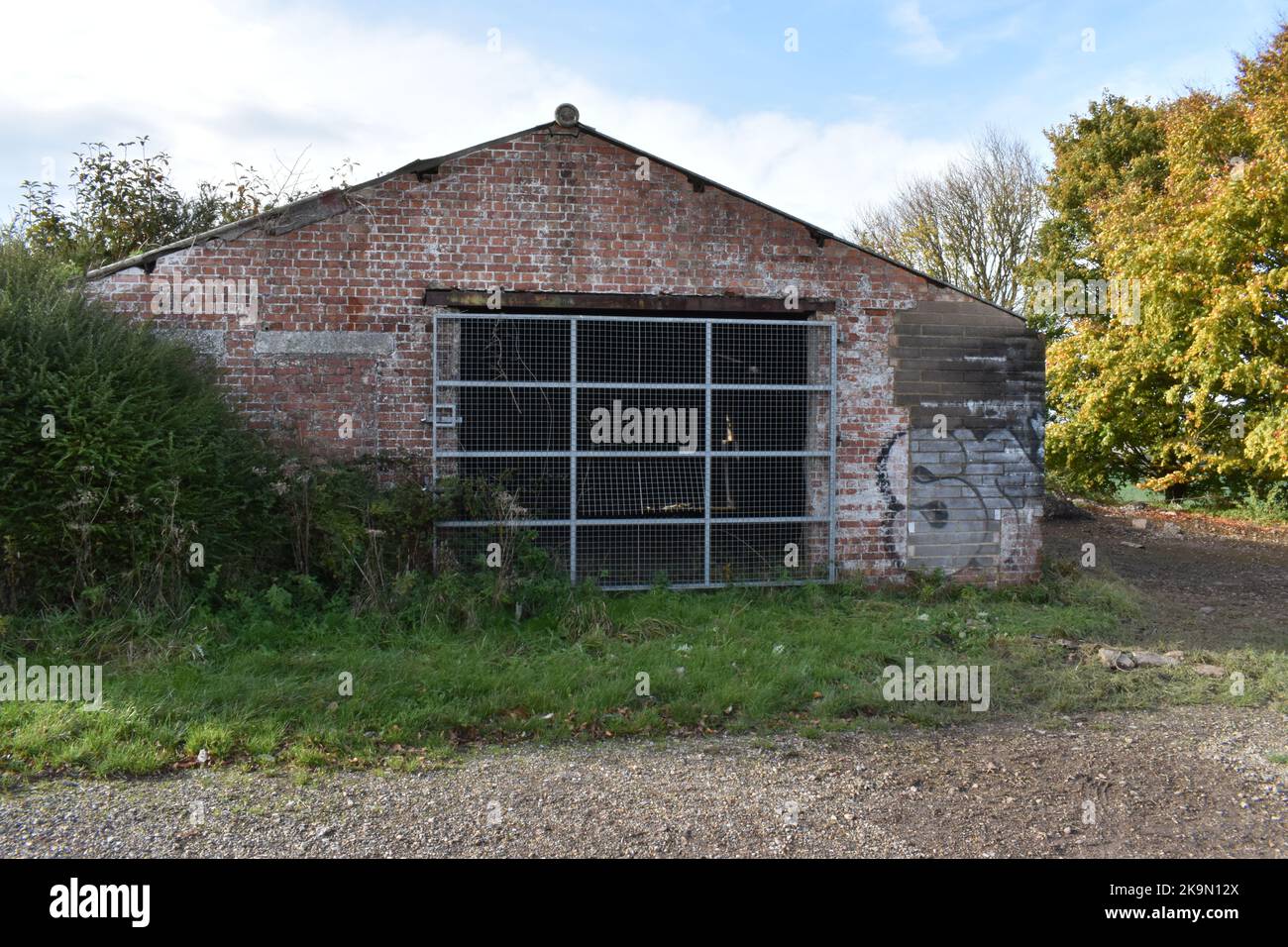 Derelict Red Brick Farm Building With Graffiti, Urban Comes To The ...