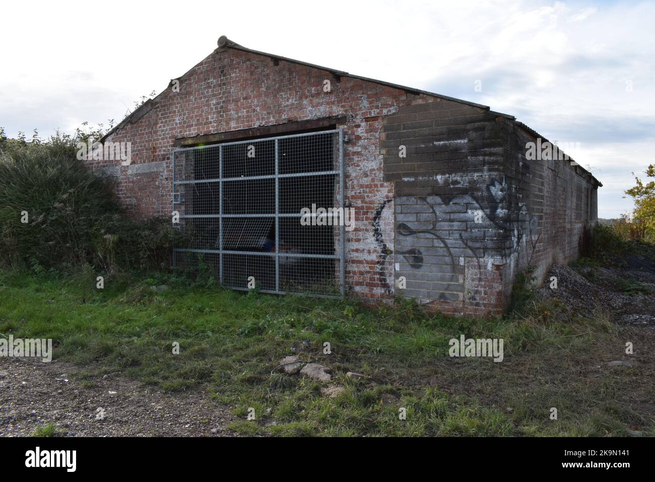 Derelict Red Brick Farm Building With Graffiti, Urban Comes To The ...