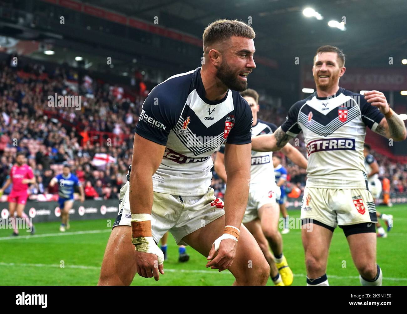 England's Mike McMeeken celebrates scoring their side's seventeenth try ...