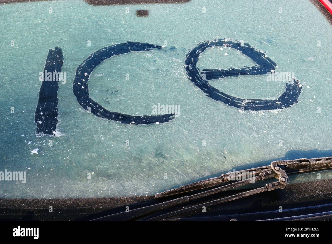 Ice written in the ice on a car's windscreen Stock Photo - Alamy