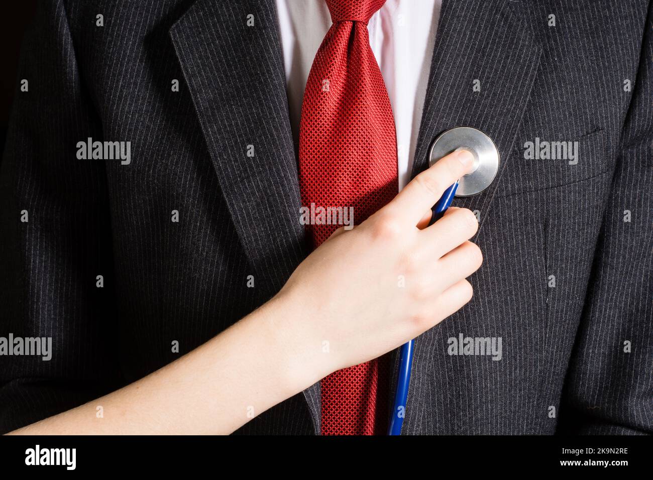 Businessman stethoscope examination on chest Stock Photo - Alamy