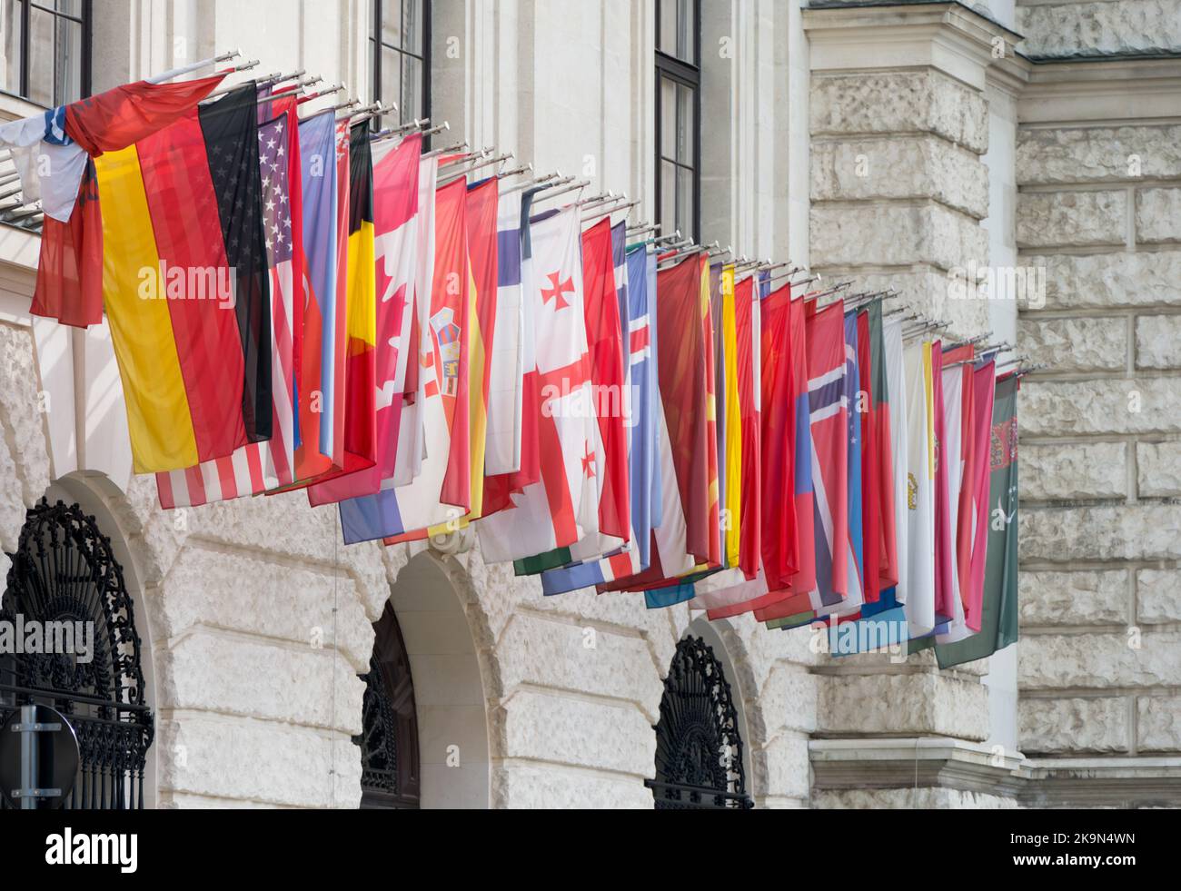 Close-up of a historical facade with mounted in a row different country ...