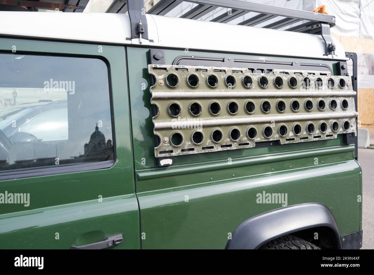 Close up partial view of a green 4x4 offroad all terrain vehicle with ...