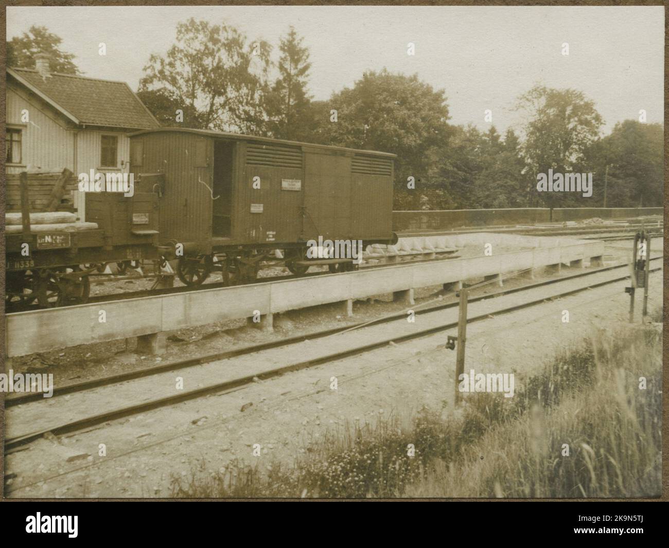 Double track building between Alingsås - Olskroken. Freight wagon open ...
