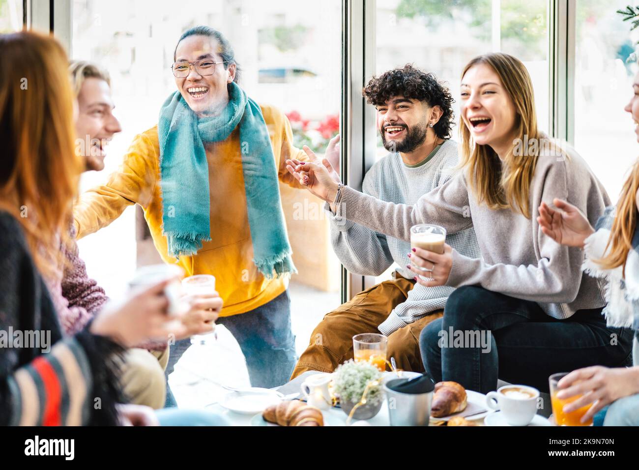 Friends group laughing together at coffee bar - Young people talking ...