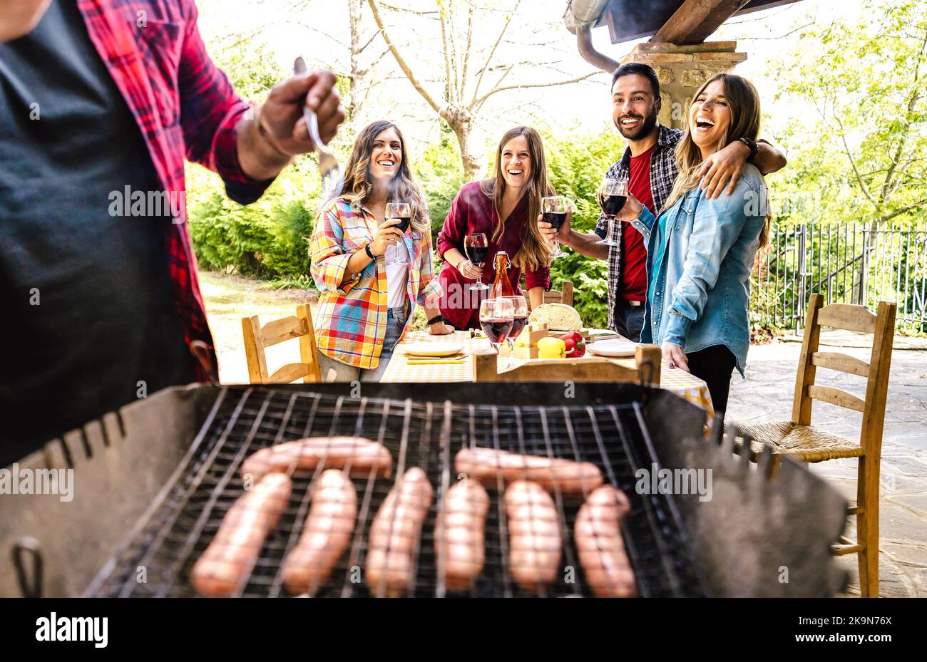 Happy friends having fun at picnic barbecue garden party - Food and ...
