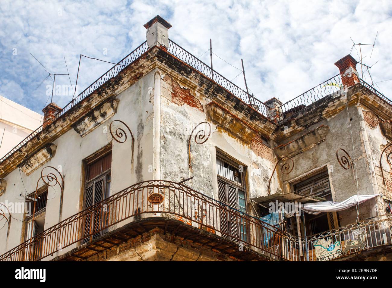 An old weathered building exterior. The run-down residential building ...