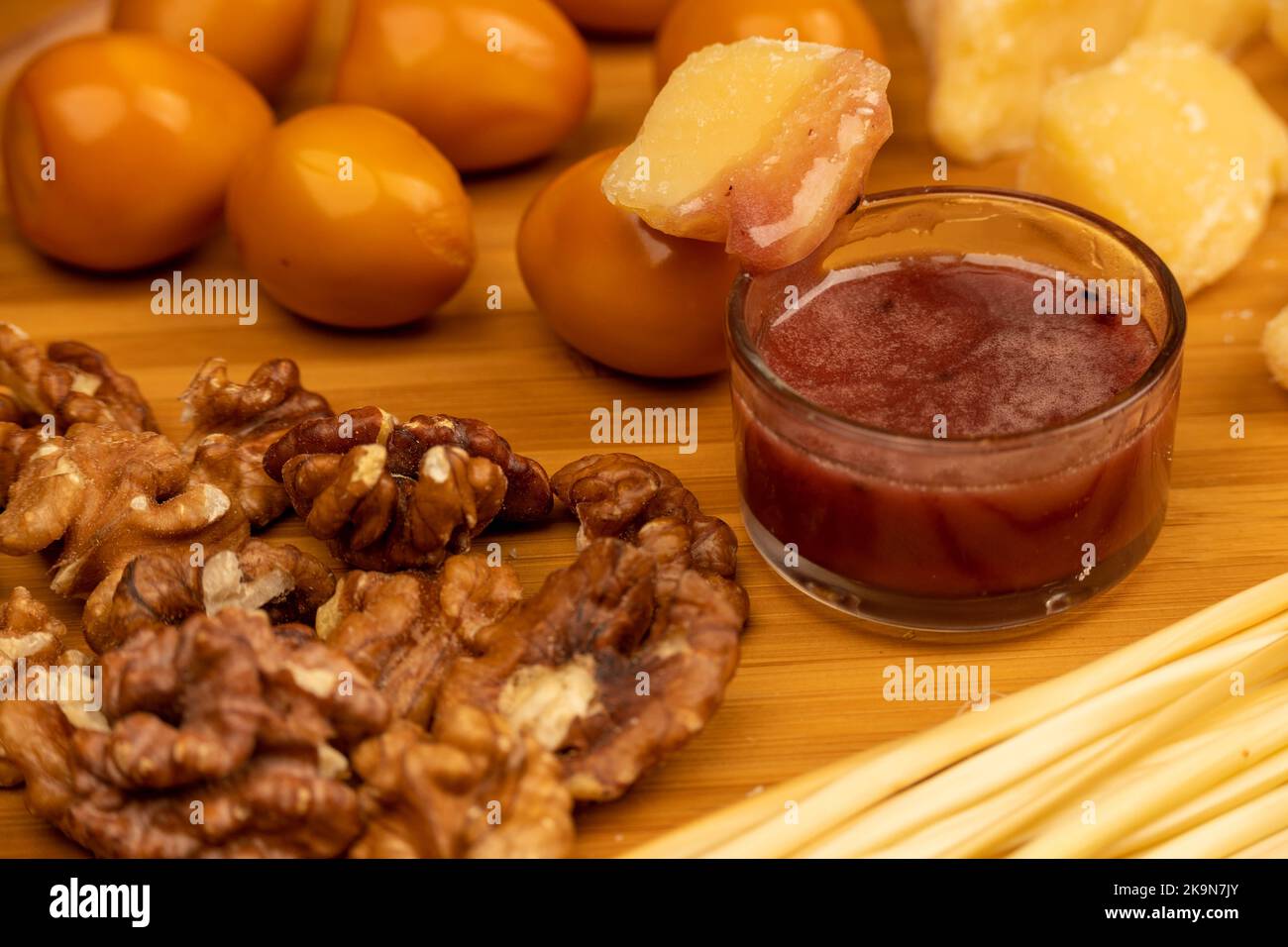 Various varieties of cheese, walnut kernels, smoked quail eggs and ...