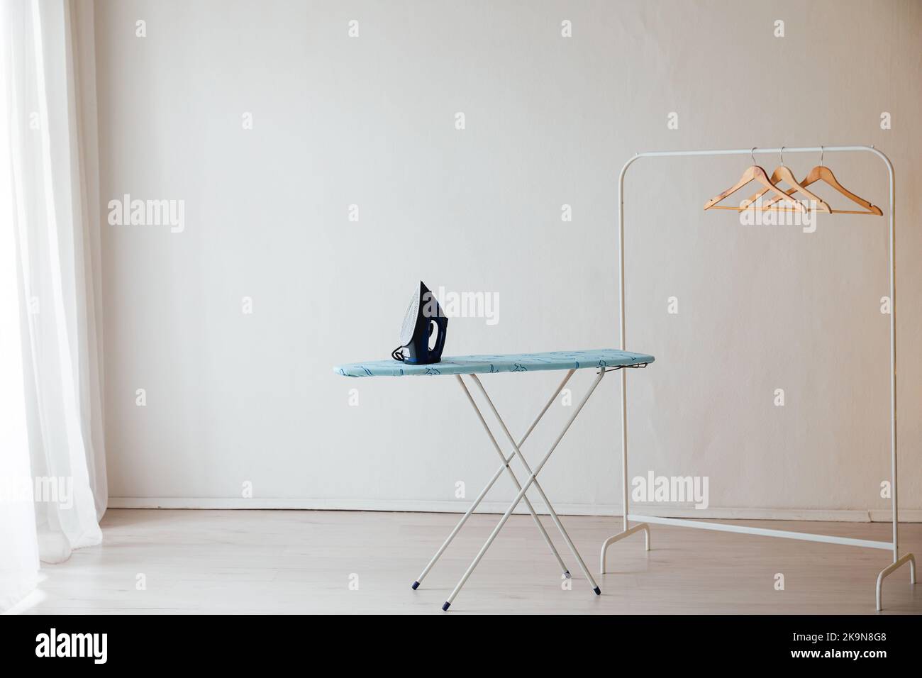 iron and ironing board for ironing things wardrobe Stock Photo - Alamy
