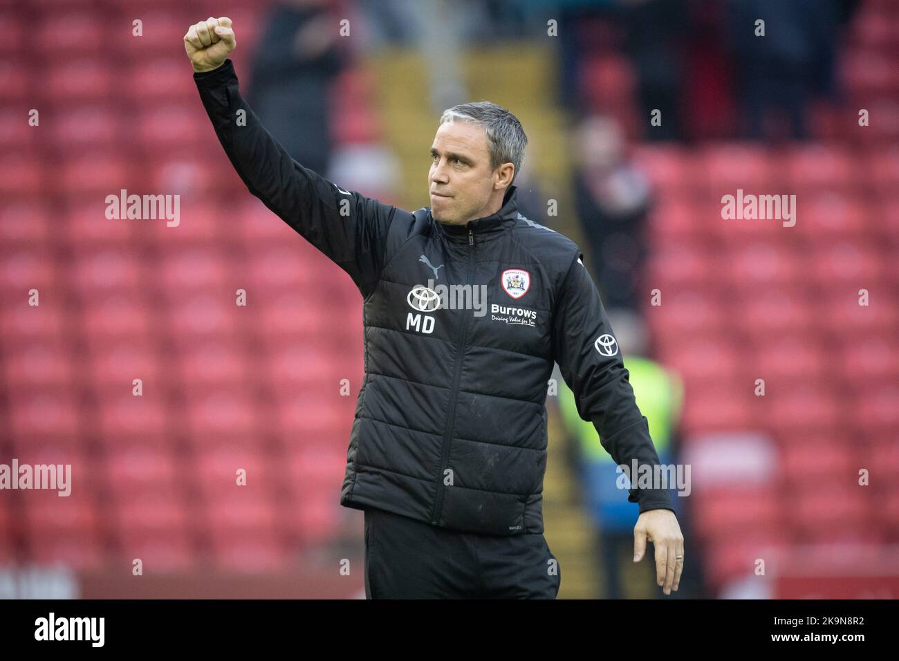 Michael Duff Head coach of Barnsley pumps his fist to the Barnsley ...