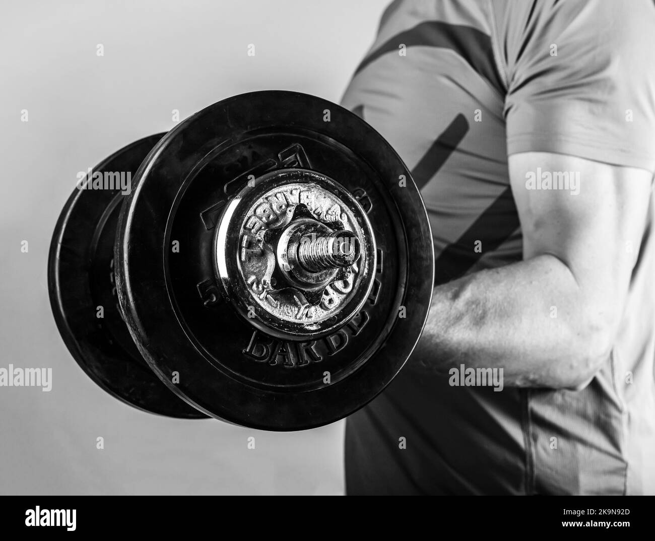 Male hand lifting dumbbell. Bodybuilder with strength. High quality ...