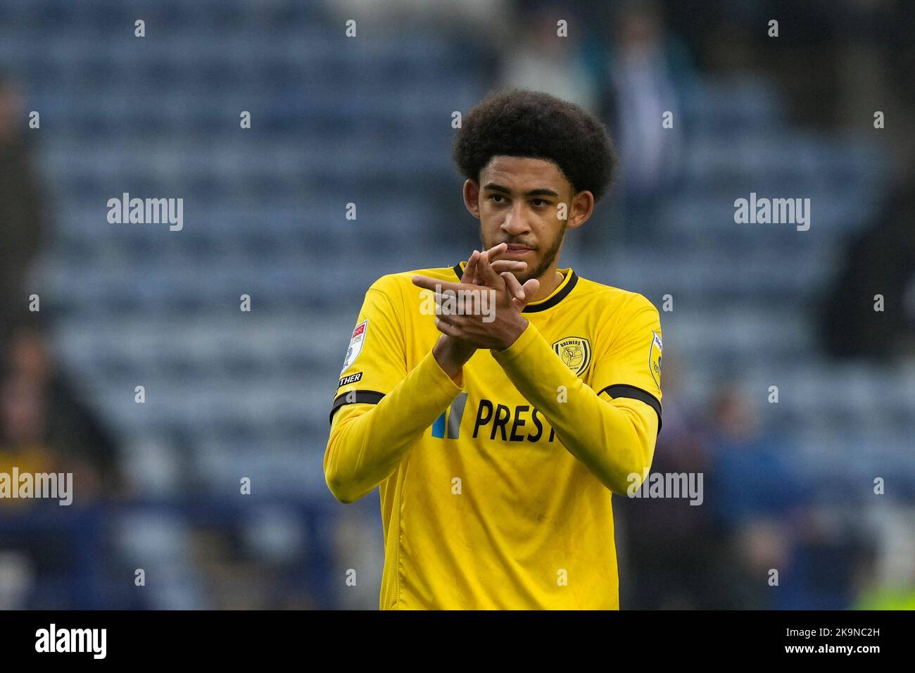 Tyler Onyango #12 of Burton Albion salutes the fans after during the ...