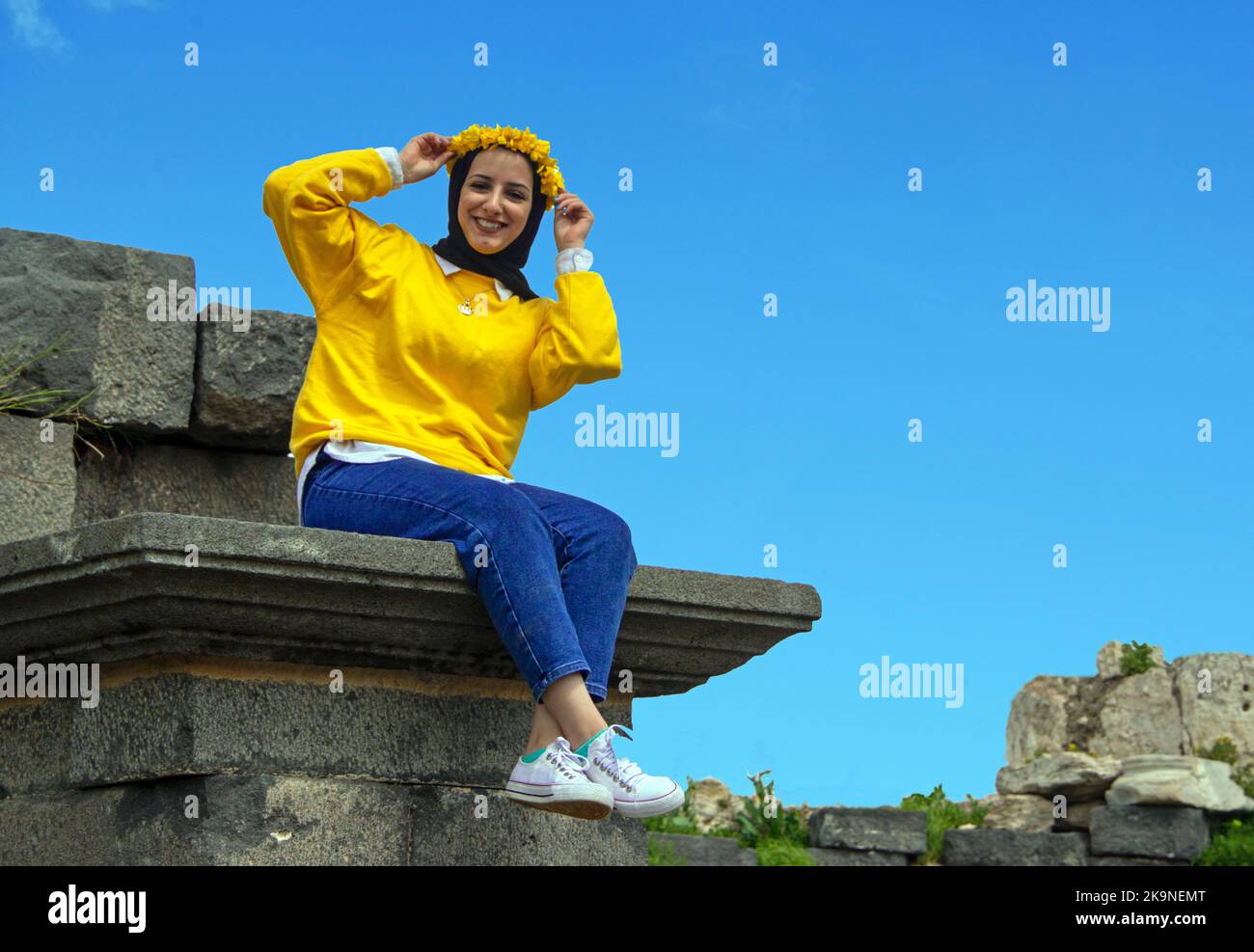 Pretty youg Jordan girl wearing Caeser yellow laurel wreath Umm Qais ...
