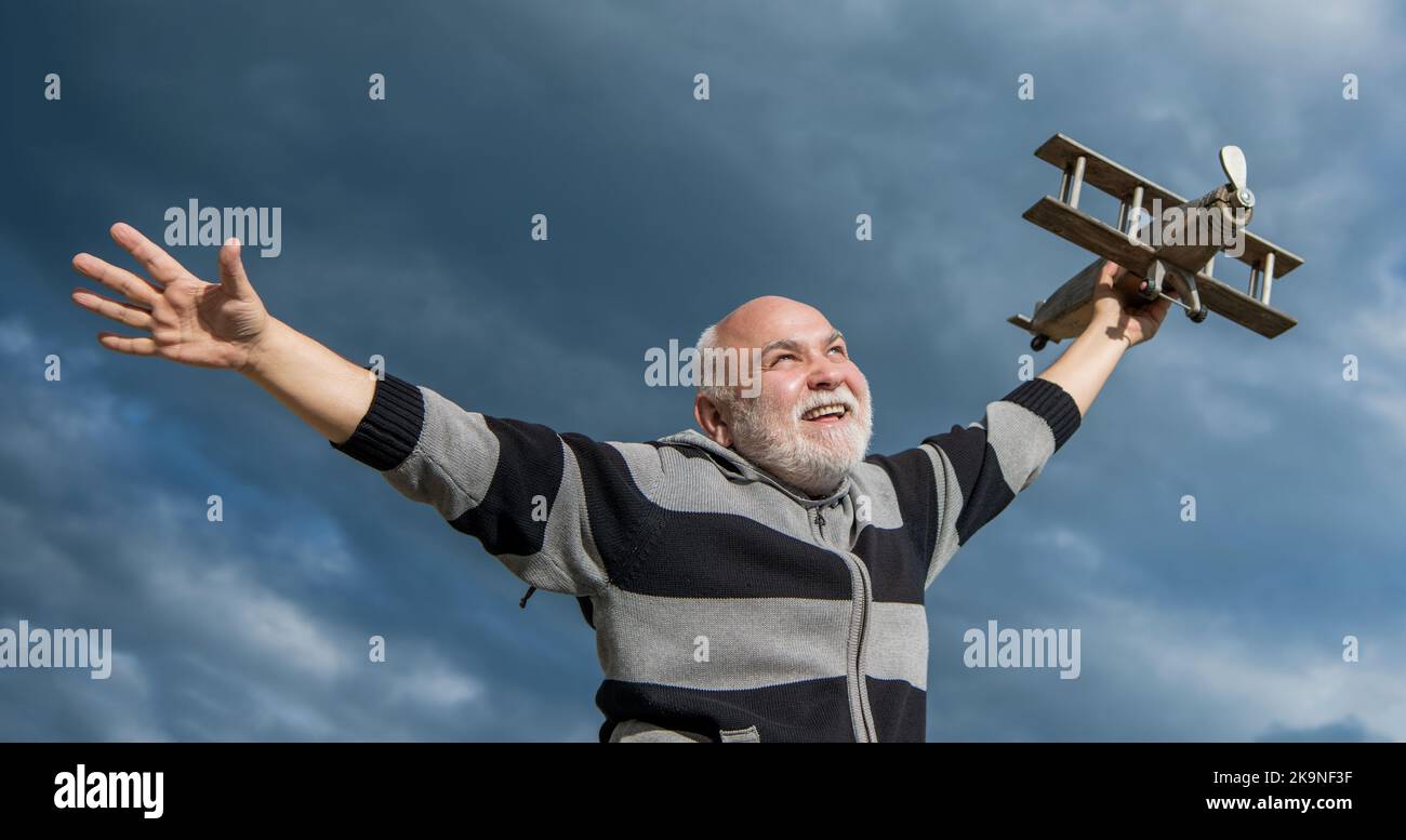 happy retirement. grizzled granddad with toy. retired old man outdoor ...