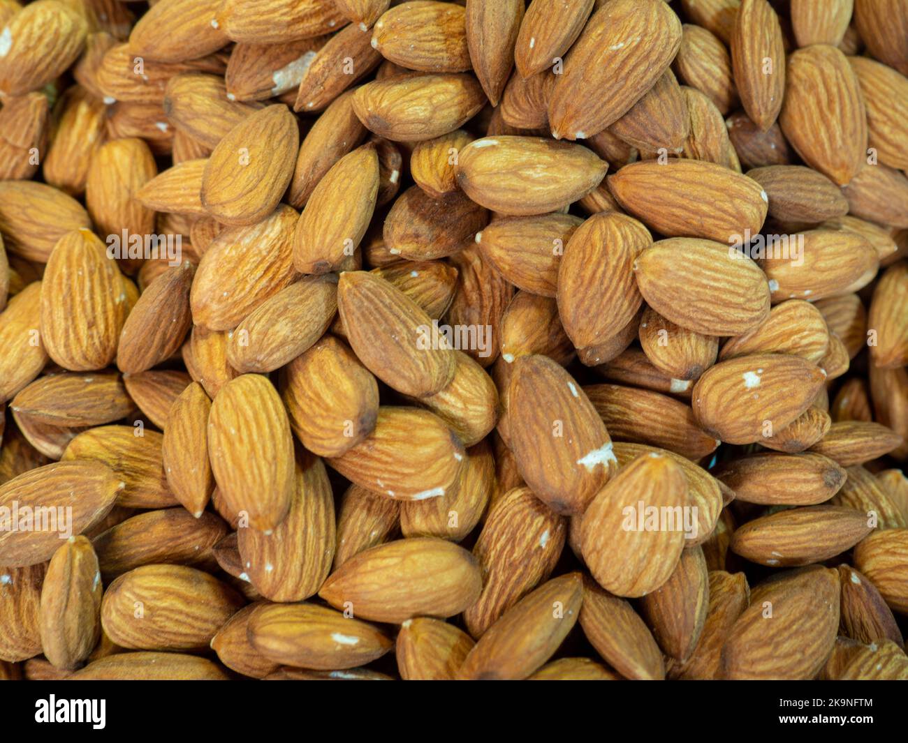 Almond nuts. Background of nuts without shell. Snack on the table ...