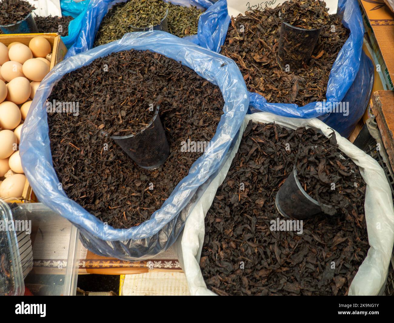 Bags with different types of tea on the market. Packing and sale of ...