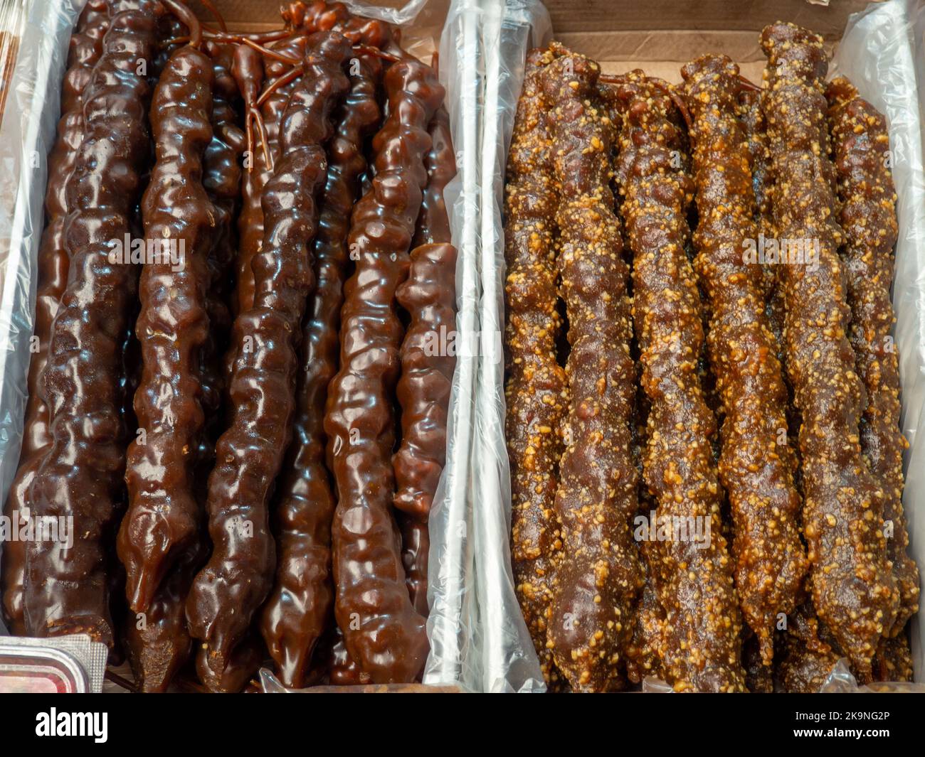 Georgian sweets. Nuts in frozen grape juice on the counter. churchkhela ...