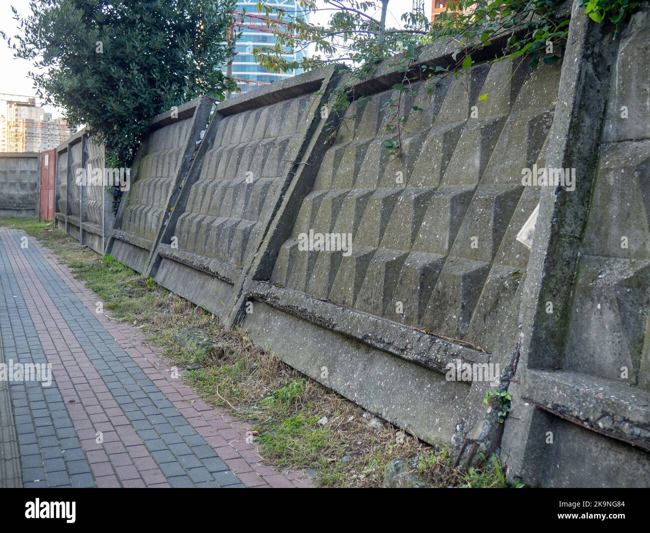Reinforced concrete fence PO-2. Decayed concrete fence. Fallen fence ...
