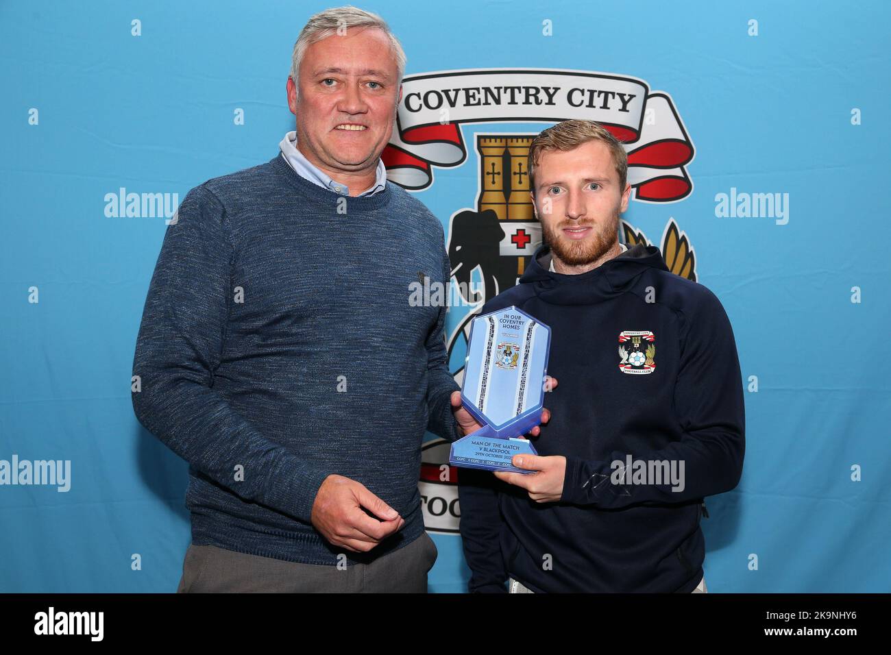 Coventry City's Jamie Allen (right) receives his Man of the Match award ...