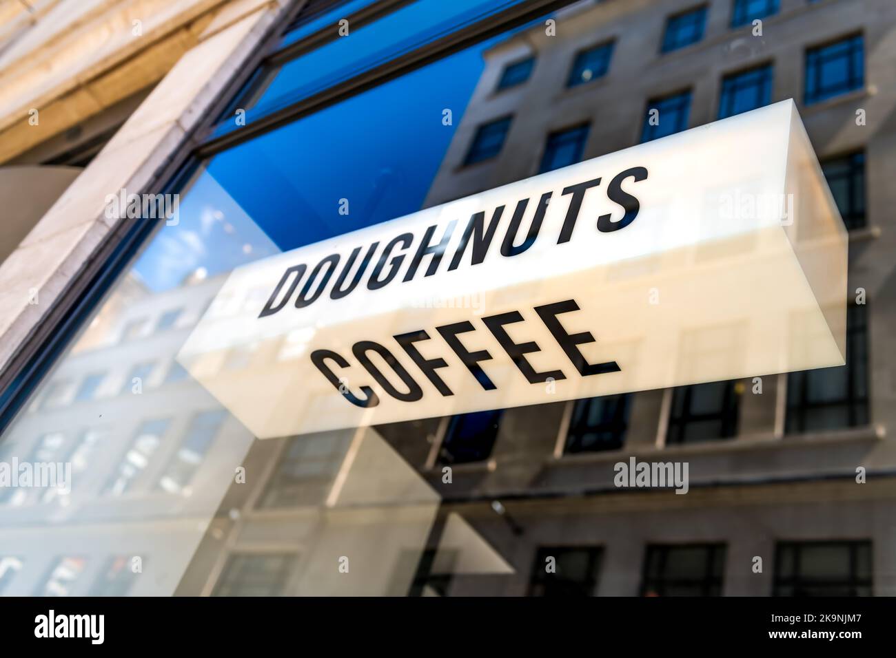 Sign for doughnuts coffee with English spelling in restaurant cafe ...