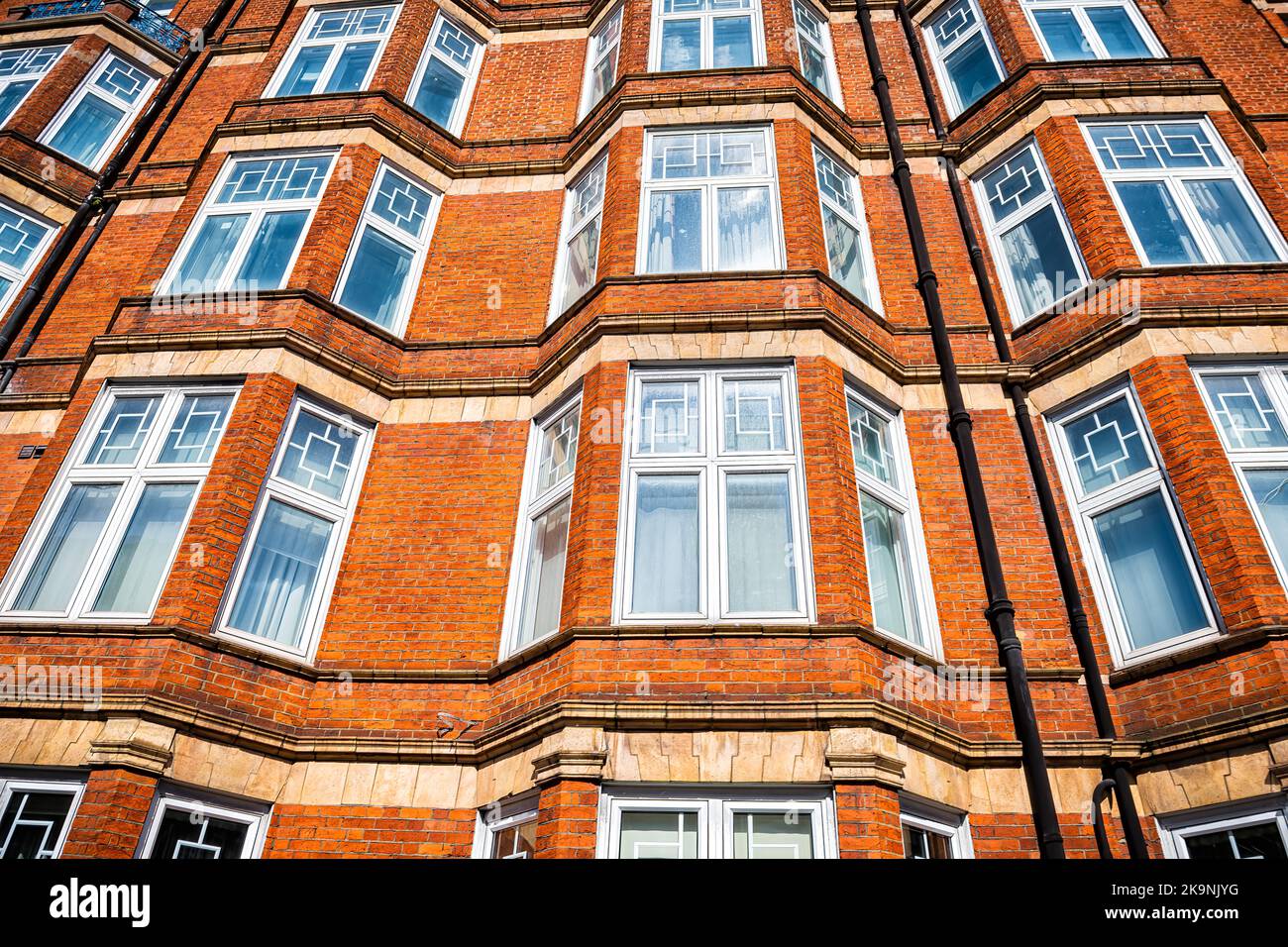 Residential apartment flats house building with many windows pattern in ...