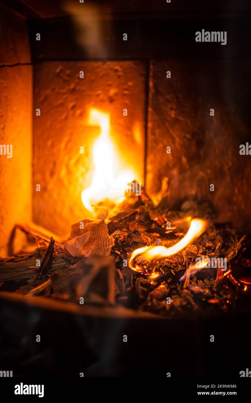 Burning paper, letters in indoor home interior fireplace in fire flames ...