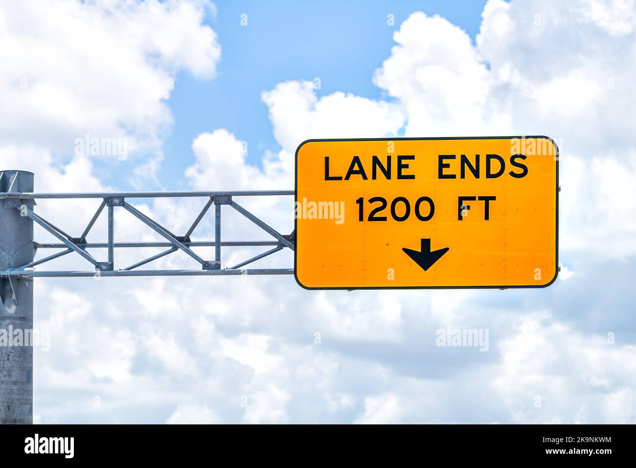 Closeup of lane ends in 1200 feet highway road above sign isolated ...