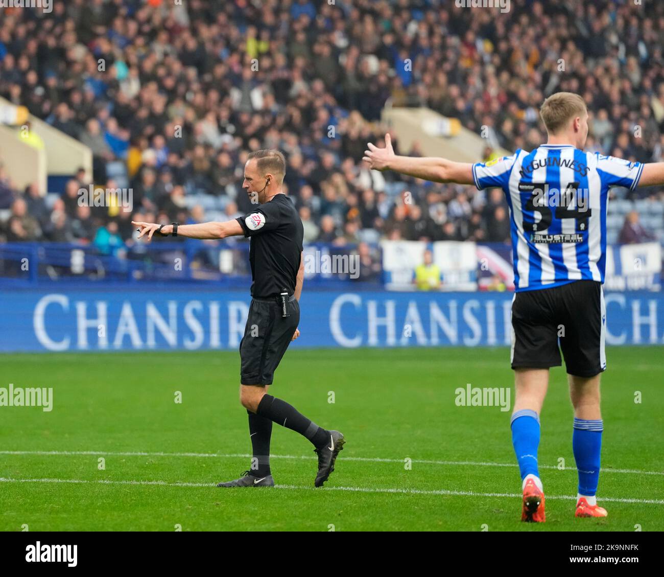 Referee David Rock points to the spot for a second penalty for ...