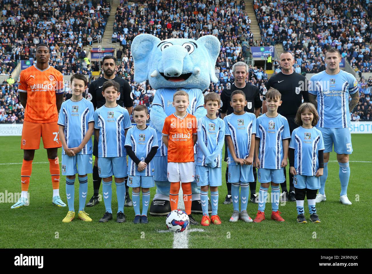 Match day mascots pose with the team captains match officials and the ...