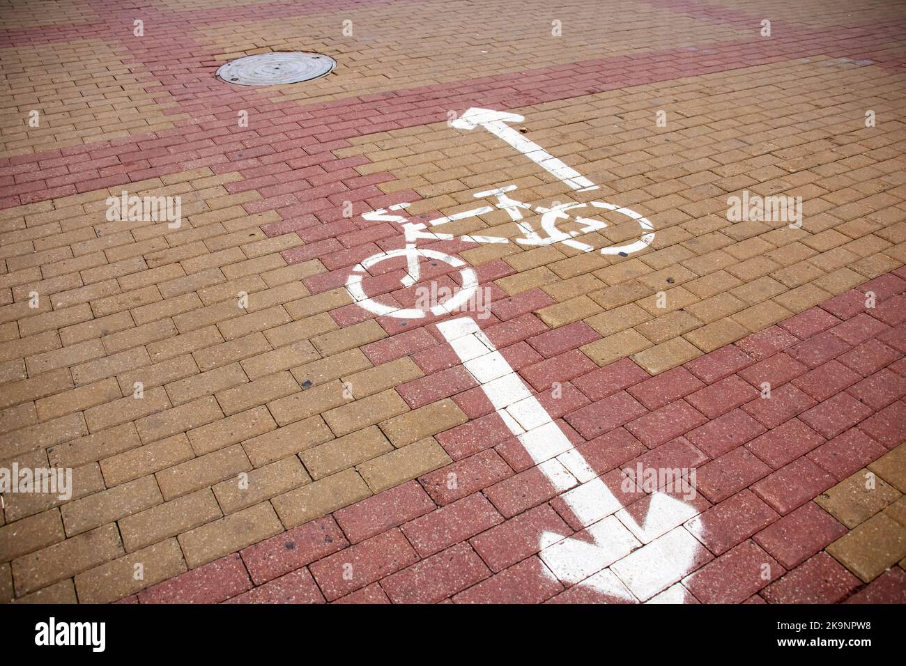 Bicycle path sign on paving slabs close up Stock Photo - Alamy