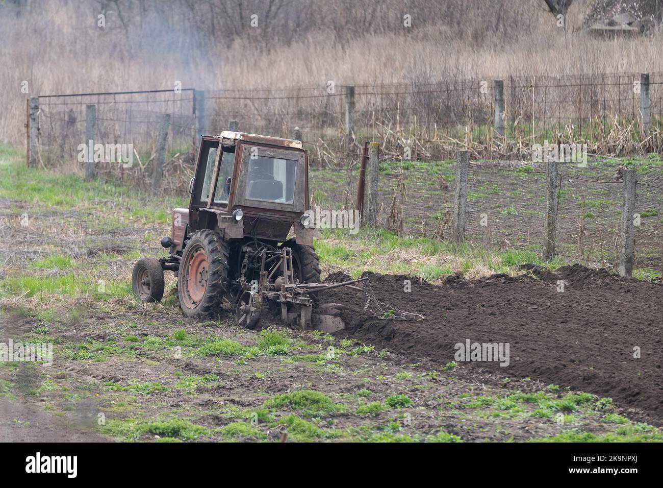 Old Belarus tractor on a ground Stock Photo - Alamy