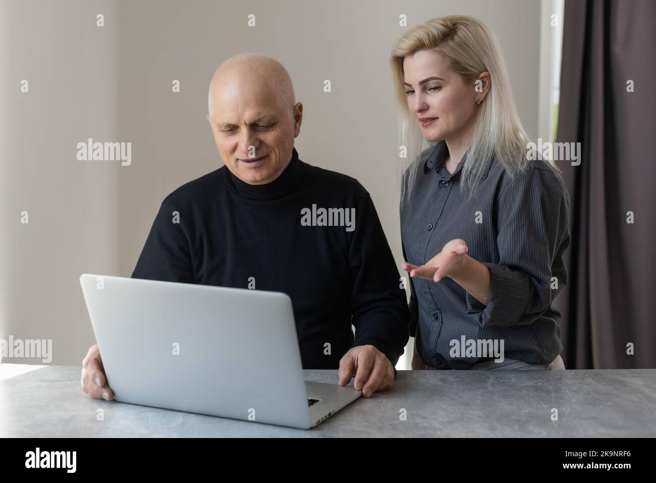 Front view happy elderly 70s grey haired man learning using computer ...