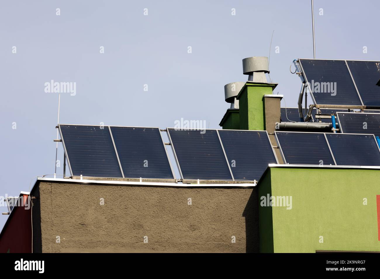 Solar panels on the roof of an apartment block. Electricity savings for ...