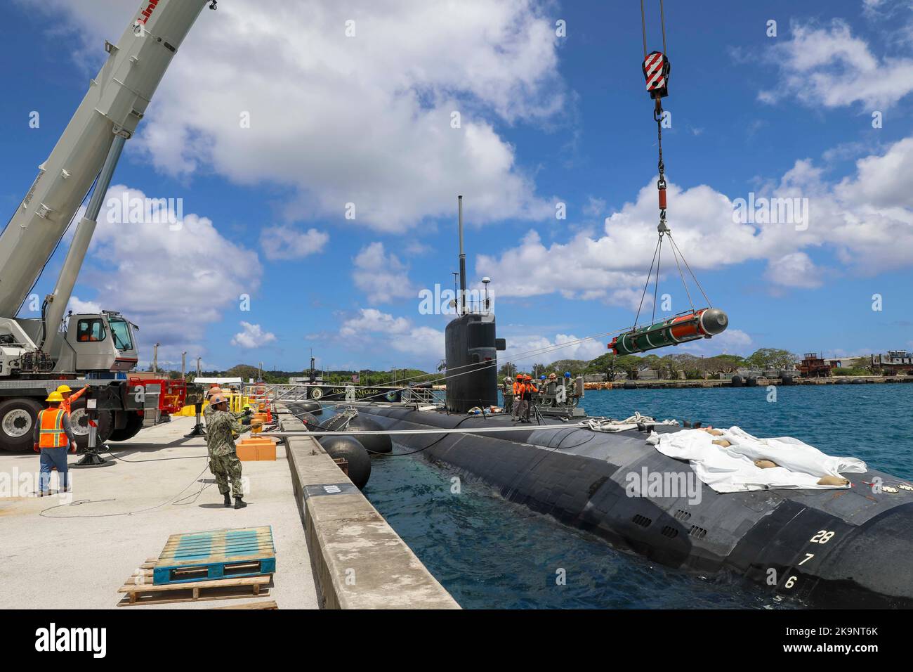 Sailors assigned to the Los Angeles-class fast-attack submarine USS ...