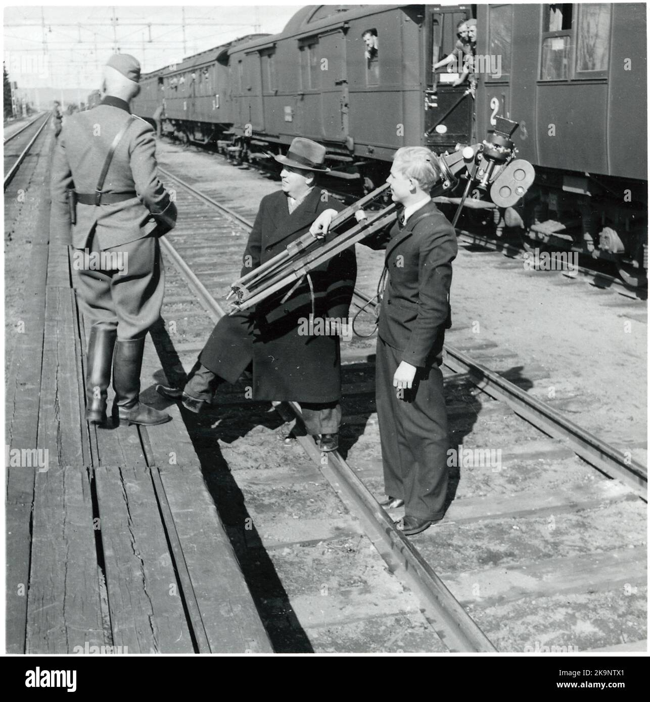 A German military and two Swedes in consultation on the track, during ...