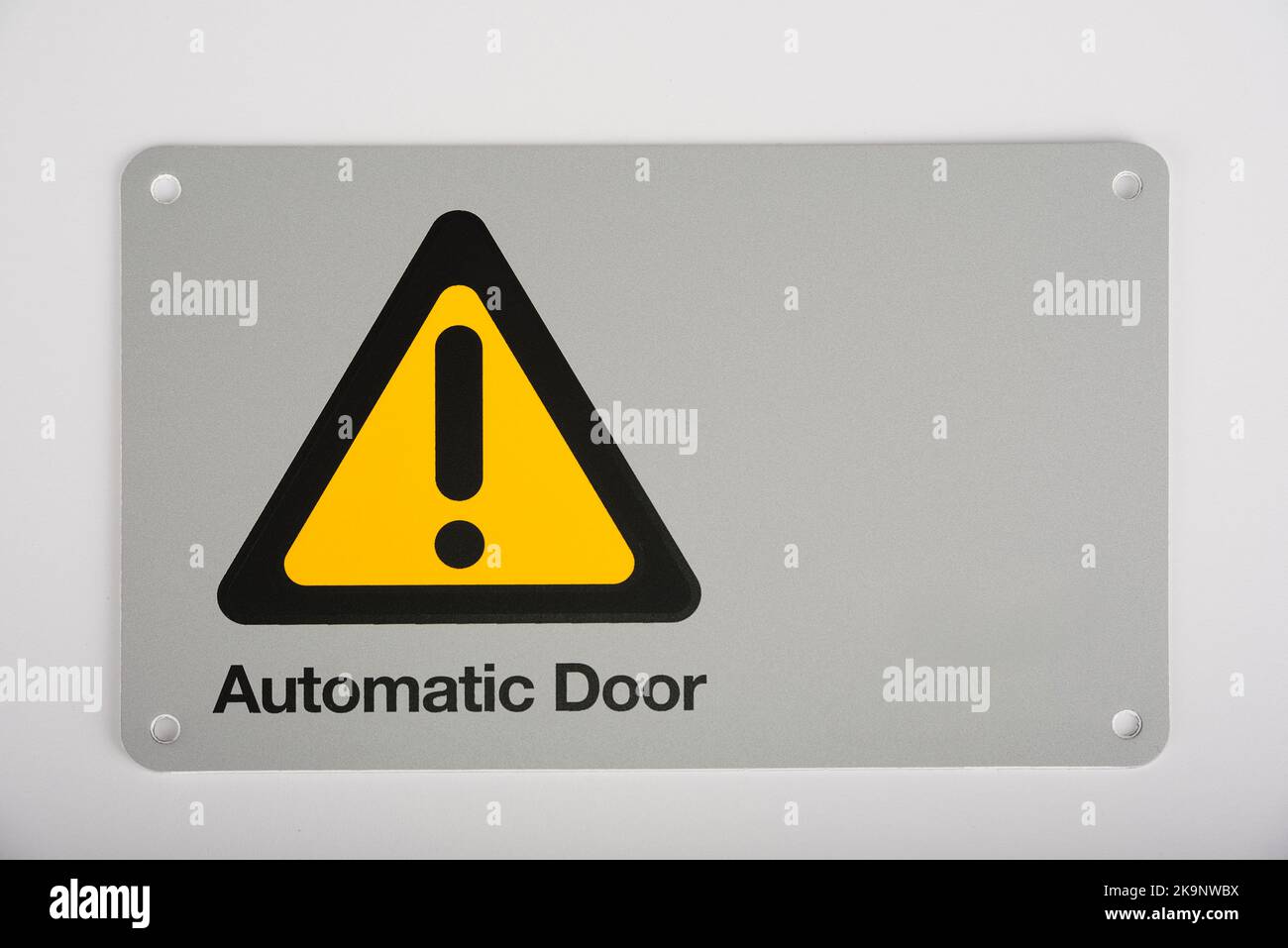 Automatic electric gate opener sign on a white Stock Photo - Alamy