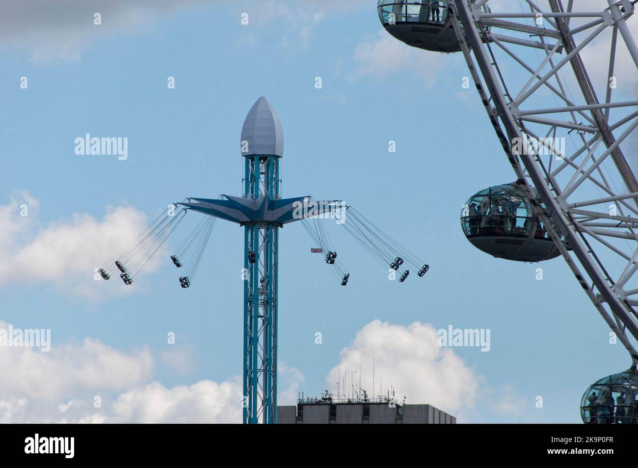 London Eye and fair ride Stock Photo - Alamy