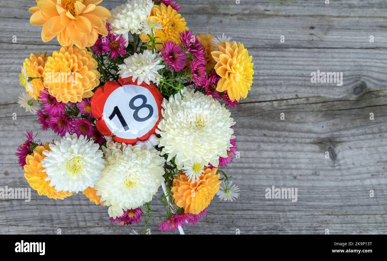 Autumn bouquet with balloon for 18th birthday Stock Photo - Alamy