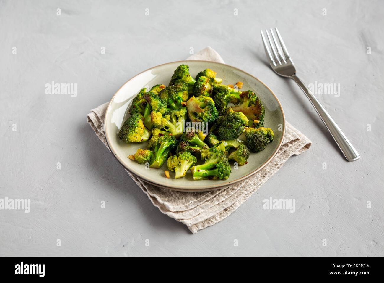 Homemade Pan-Fried Broccoli on a Plate, side view Stock Photo - Alamy