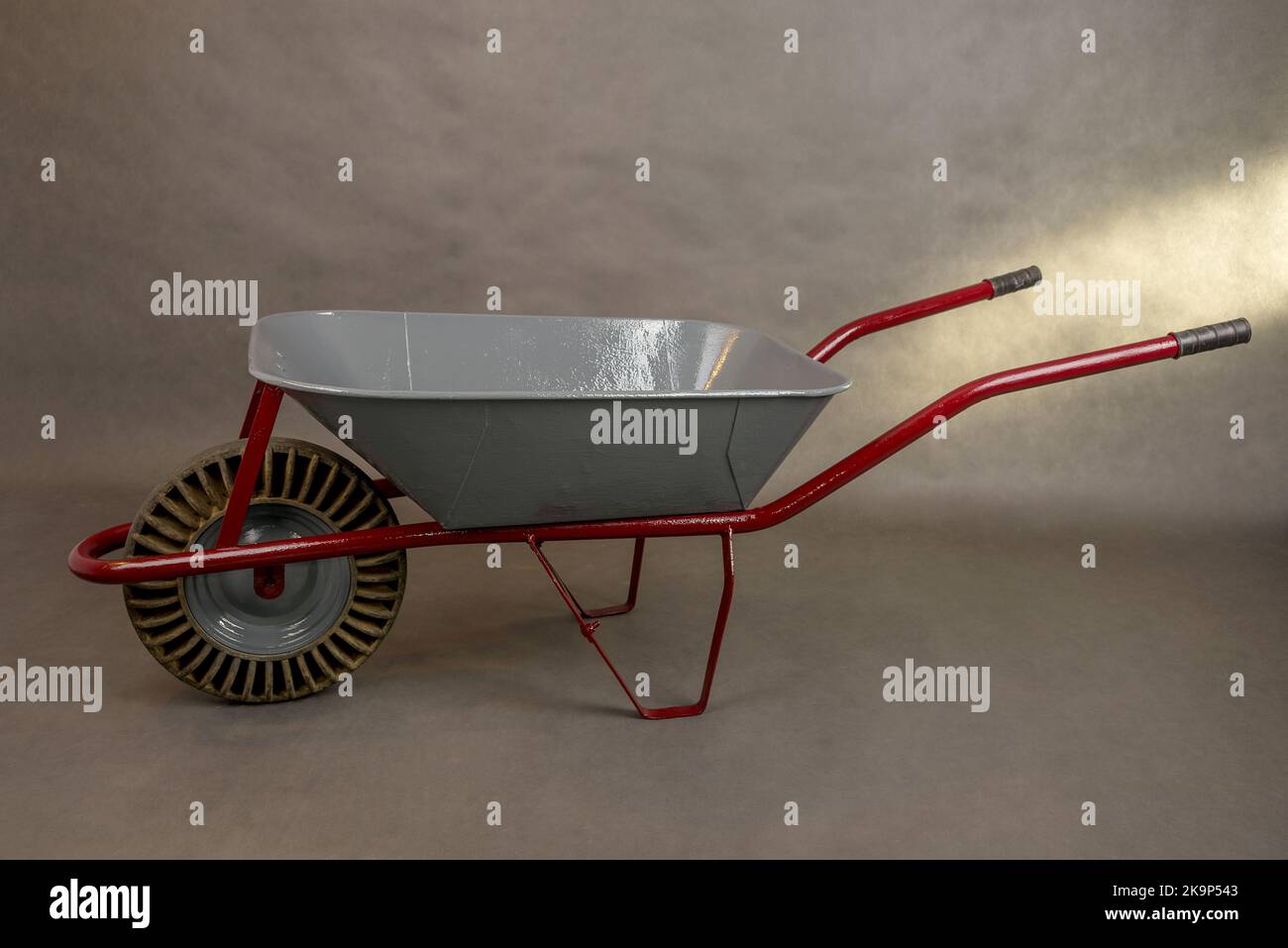 Painted wheelbarrow on a concrete tiles Stock Photo - Alamy