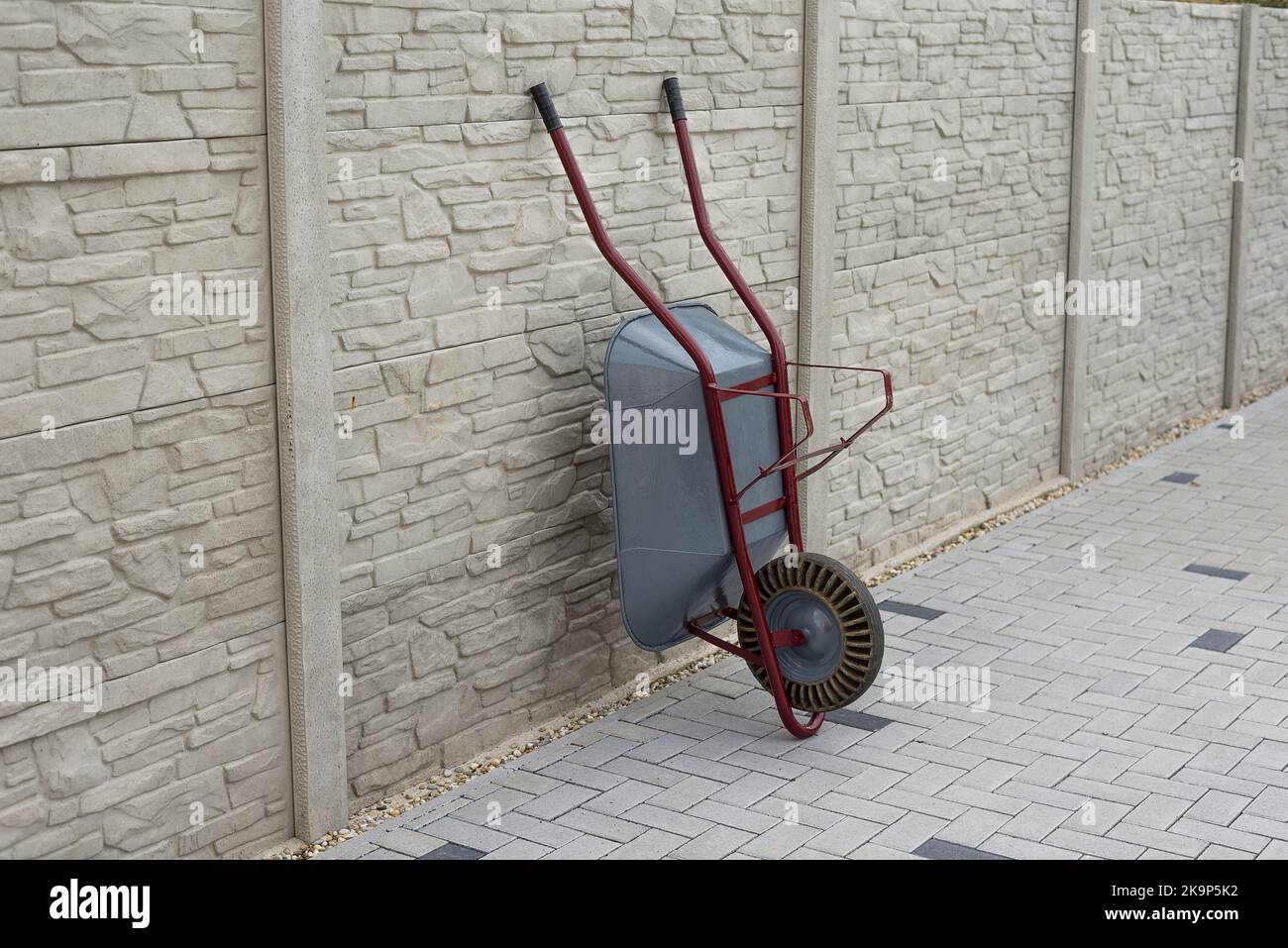 Painted wheelbarrow on a concrete tiles Stock Photo - Alamy