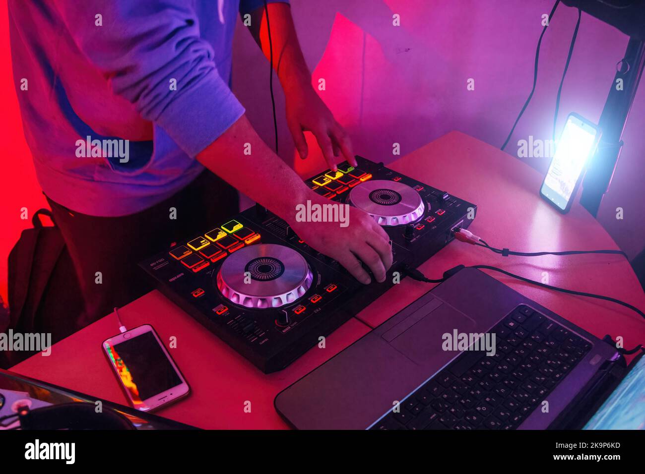 DJ with equipment turntable console at in the night club Stock Photo ...