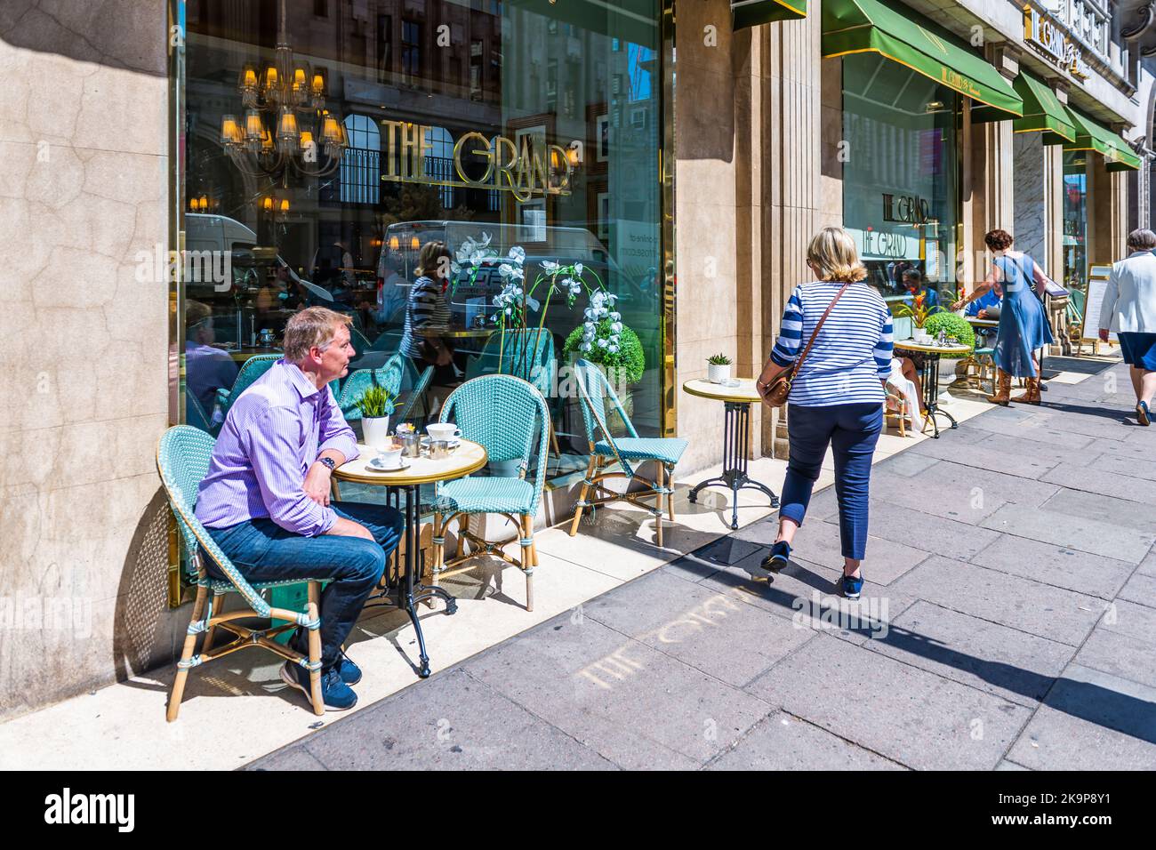 London, United Kingdom - June 22, 2018: People sitting at bakery cafe ...