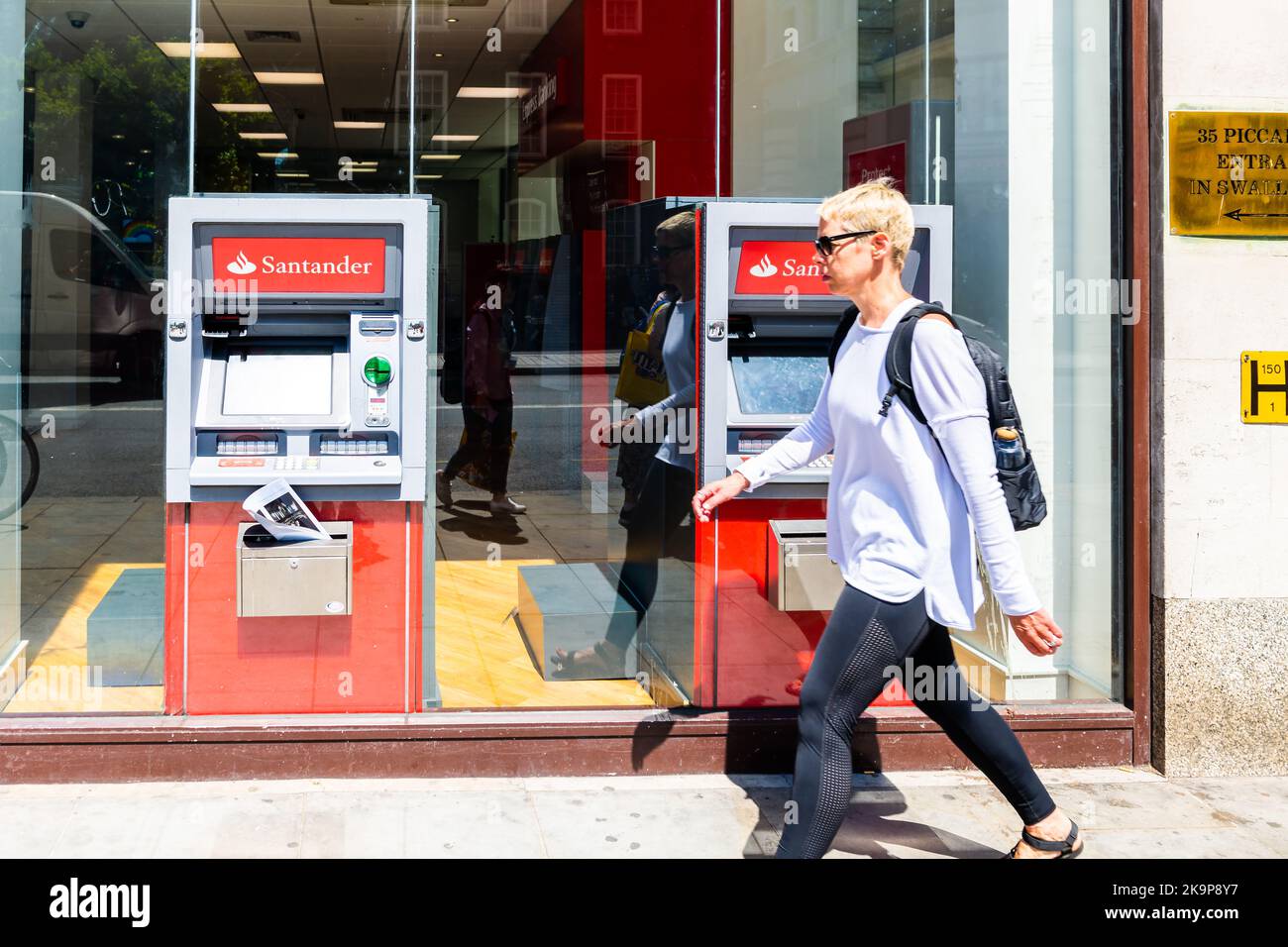 London, United Kingdom - June 22, 2018: Red Santander bank cash sign ...