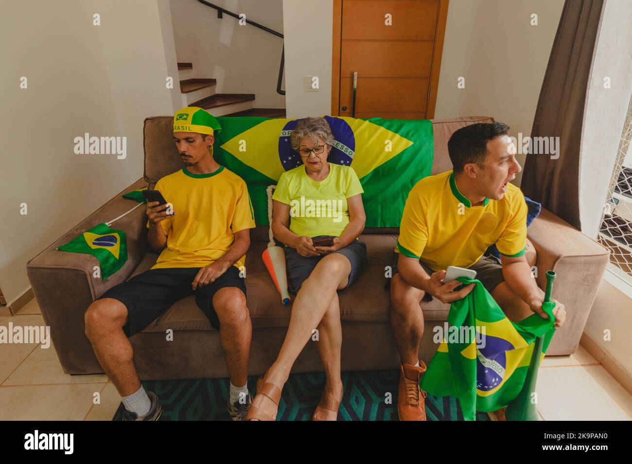 Group of Soccer Fans Celebrating the cup in the living room watching ...