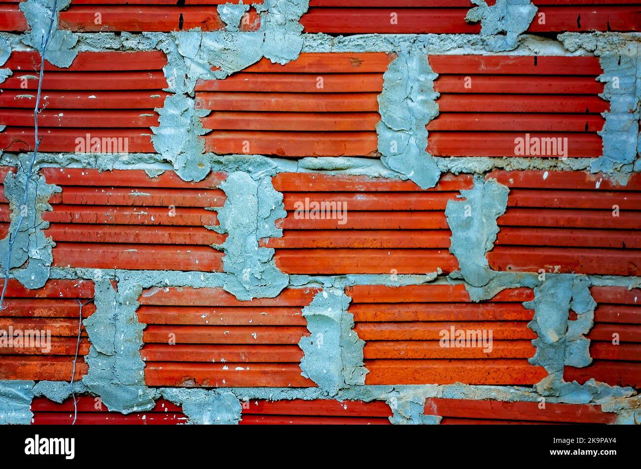 Bricks with horizontal grooves and messy mortar are pictured, Oct. 24 ...