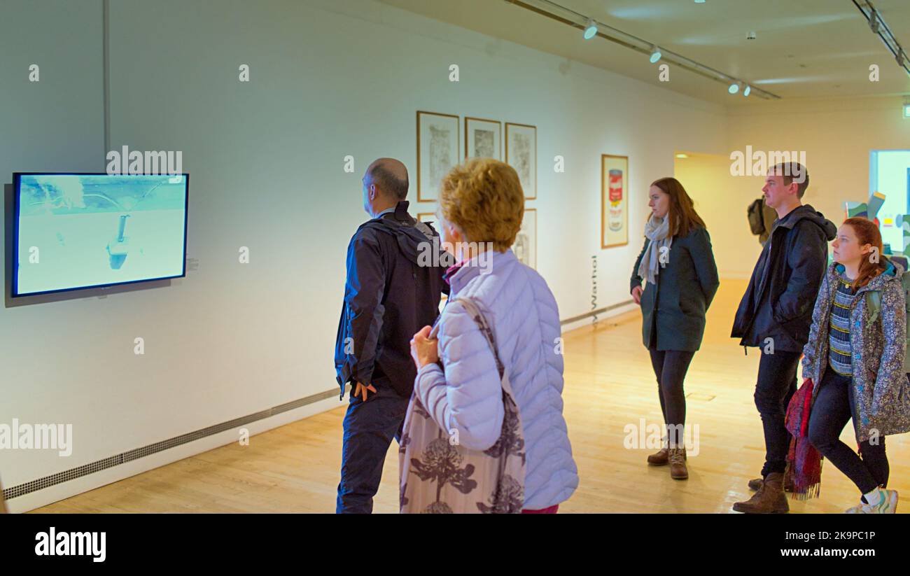 Tourists and locals enjoy the galleries at the goma or. Glasgow museum ...